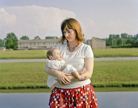 Photographs of hyper-realistic dolls and their mothers